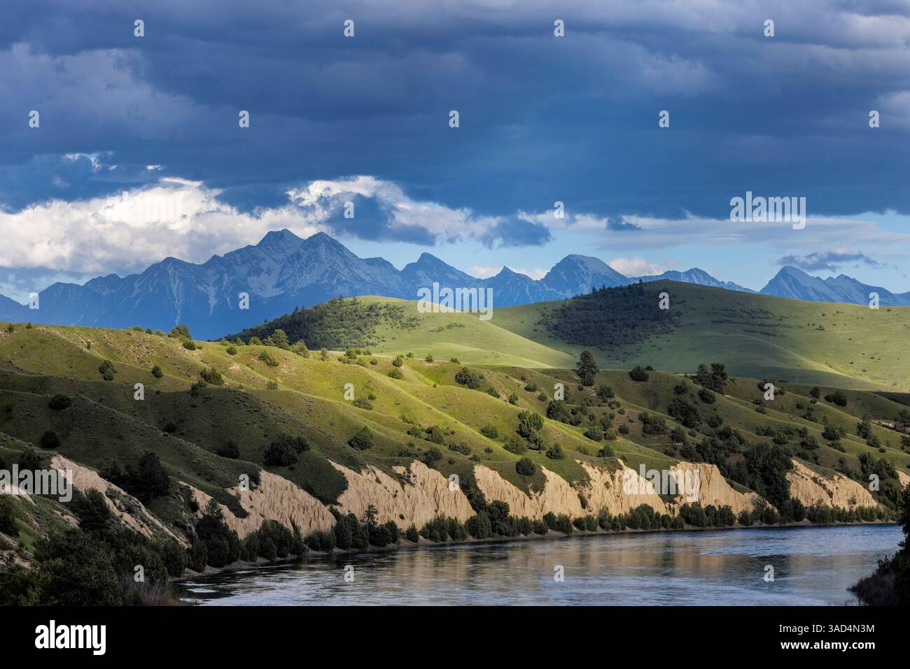 Clay cliffs along the Flathead River with Mission Mountains near Ronan ...