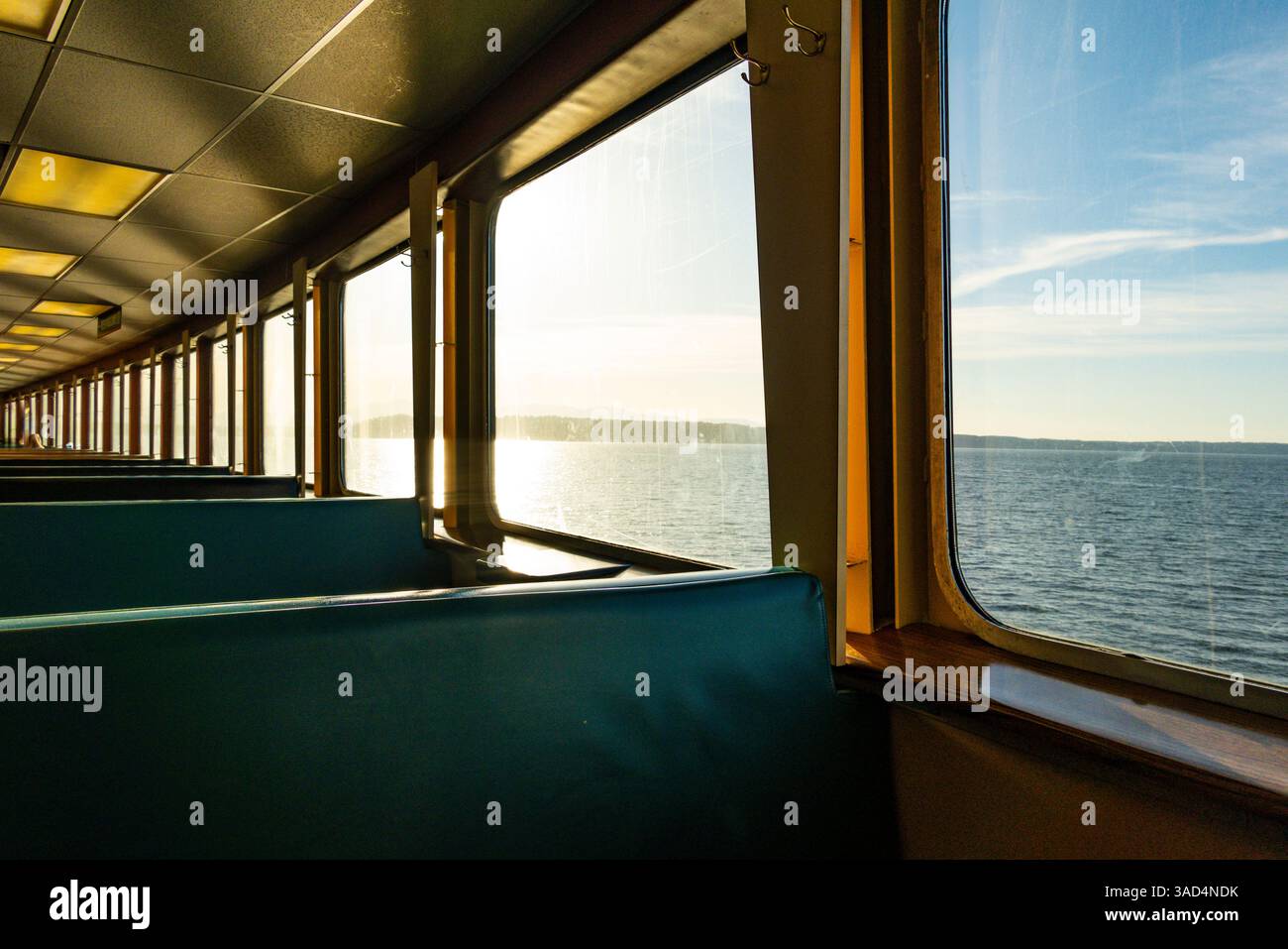 Row of seats and window view of Puget Sound on the Spokane ferry ...