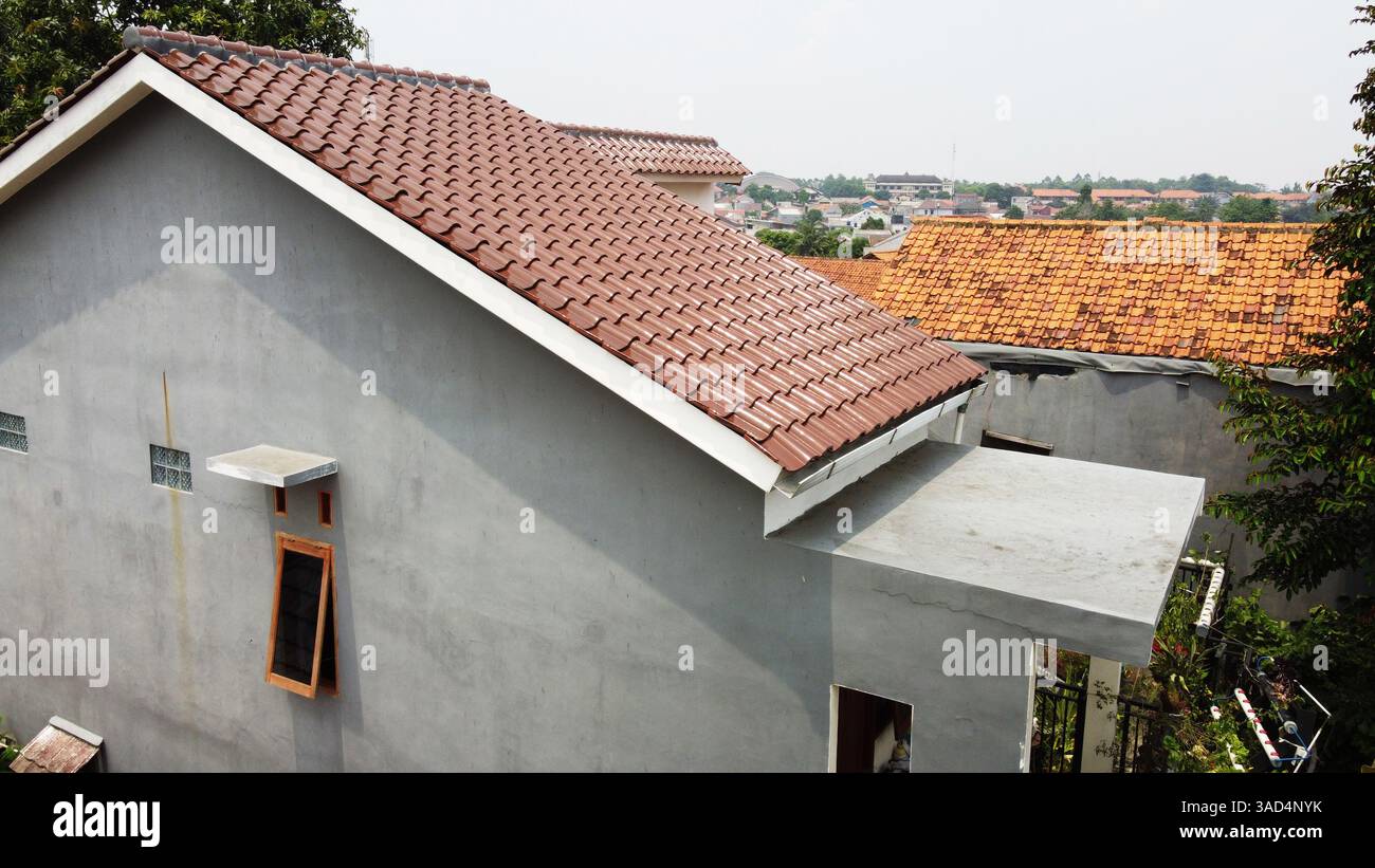 The rooftiles and walls of the house as seen from a side view in Depok ...