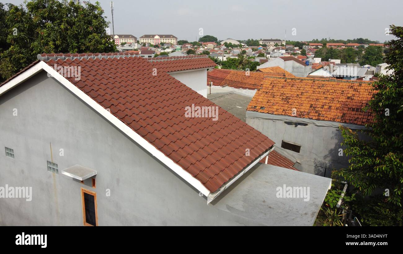 The rooftiles and walls of the house as seen from a side view in Depok ...