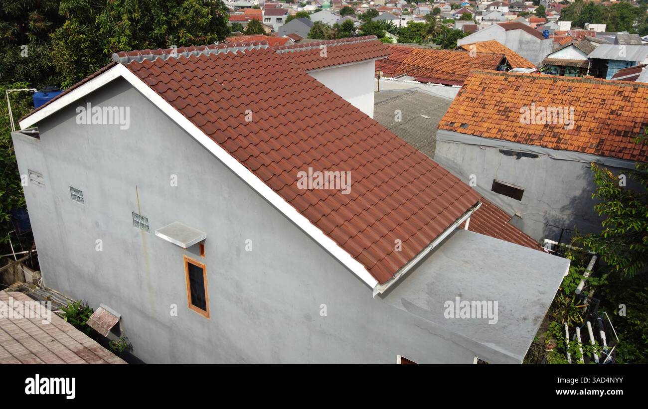 The rooftiles and walls of the house as seen from a side view in Depok ...