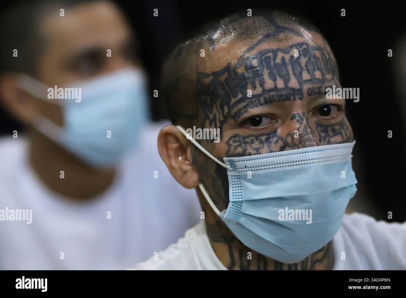 Prisoners sit in their cell as Costa Rica Justice and Peace minister ...