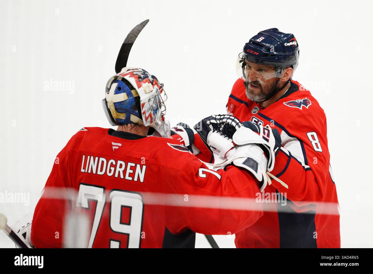 Washington Capitals left wing Alex Ovechkin (8) with goaltender Charlie ...