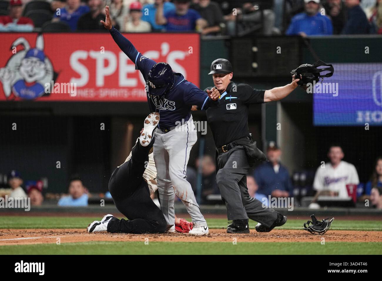 Tampa Bay Rays' Christopher Morel, center, collides with Texas Rangers ...