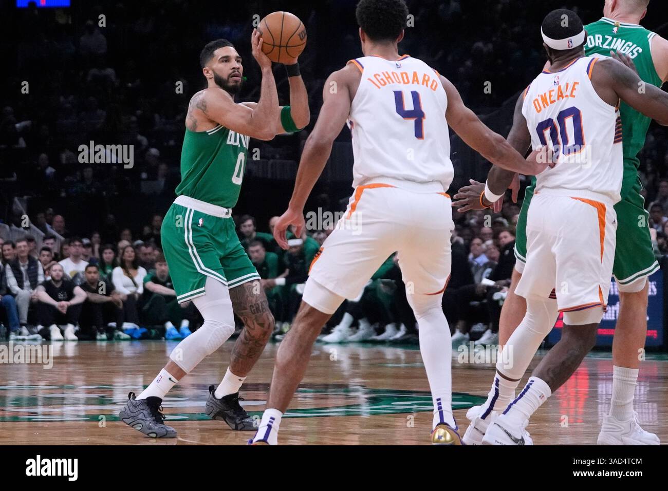 Boston Celtics forward Jayson Tatum (0) takes a 3-point shot against ...