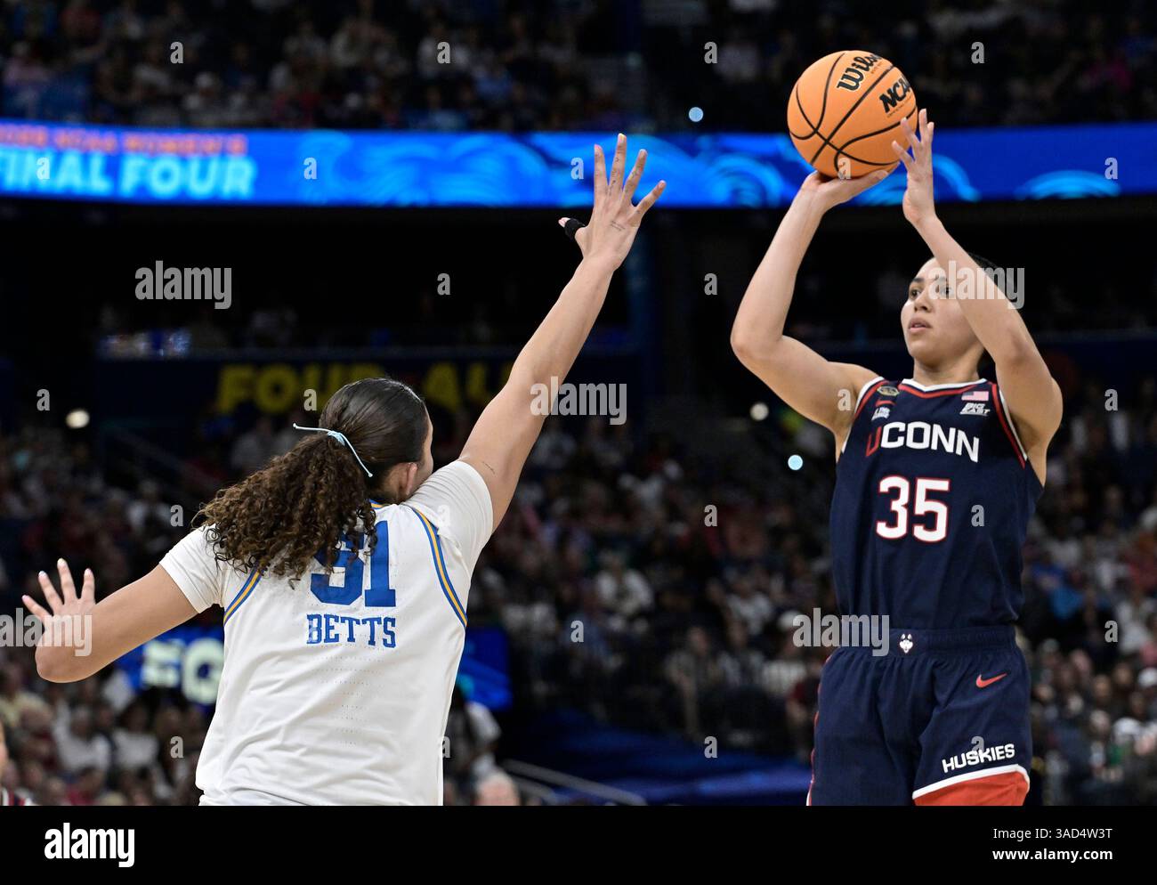 UConn guard Azzi Fudd (35) shoots over UCLA center Lauren Betts (51) in ...