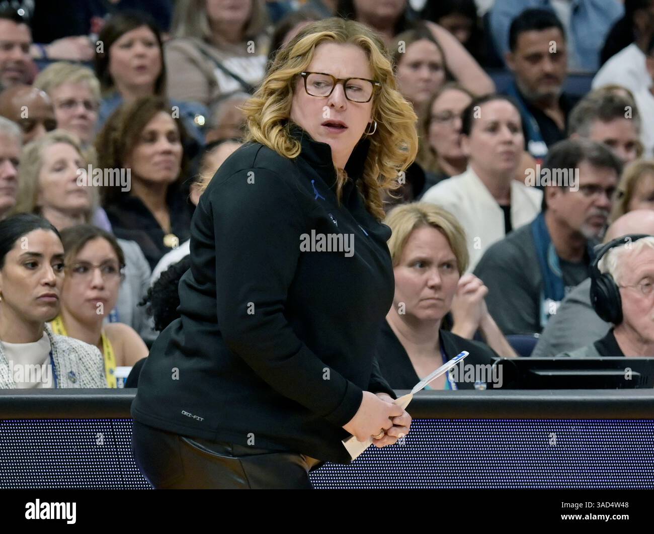 UCLA head coach Cori Close watches her team in the first half against ...