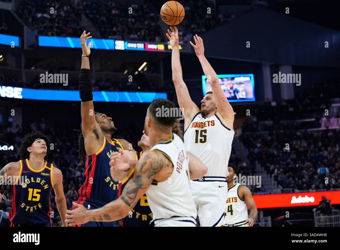 Denver Nuggets center Nikola Jokic (15) shoots over Golden State ...