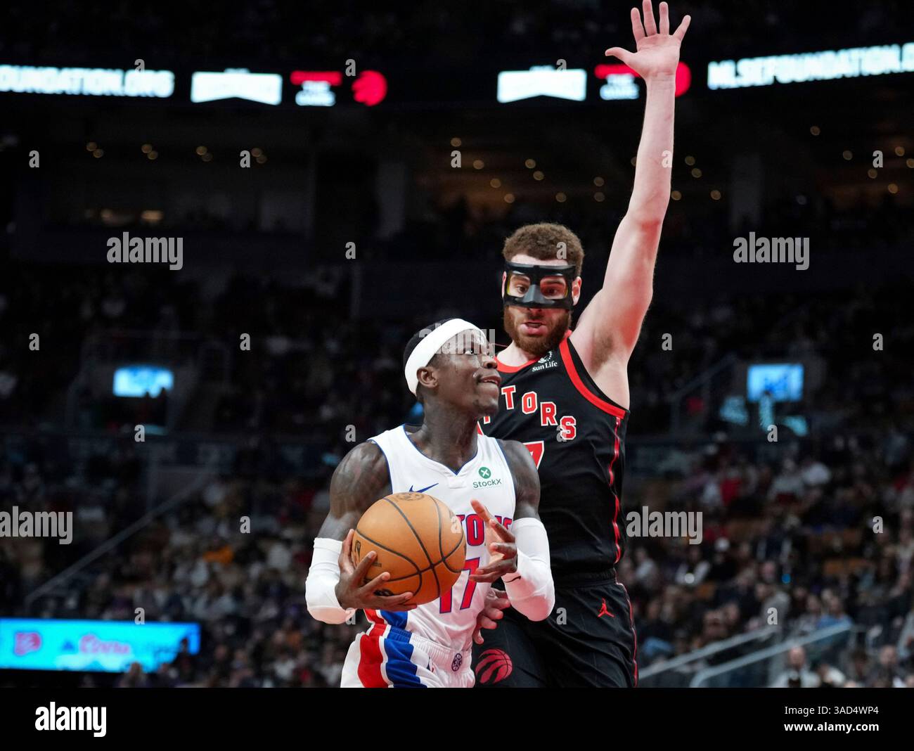 Detroit Pistons guard Dennis Schroder (17) drives past Toronto Raptors ...