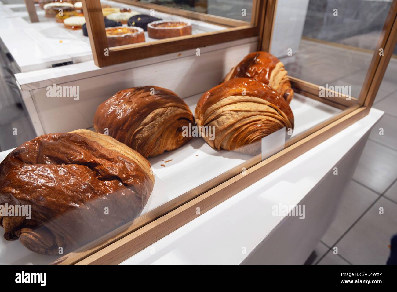Various baked goods on display in a bakery. Paris, France Stock Photo ...