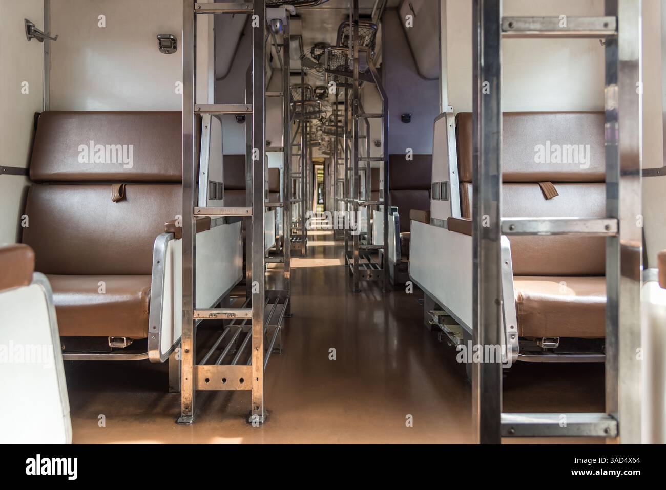 Inside of old public Thai railway train cabin with seats, handrails ...