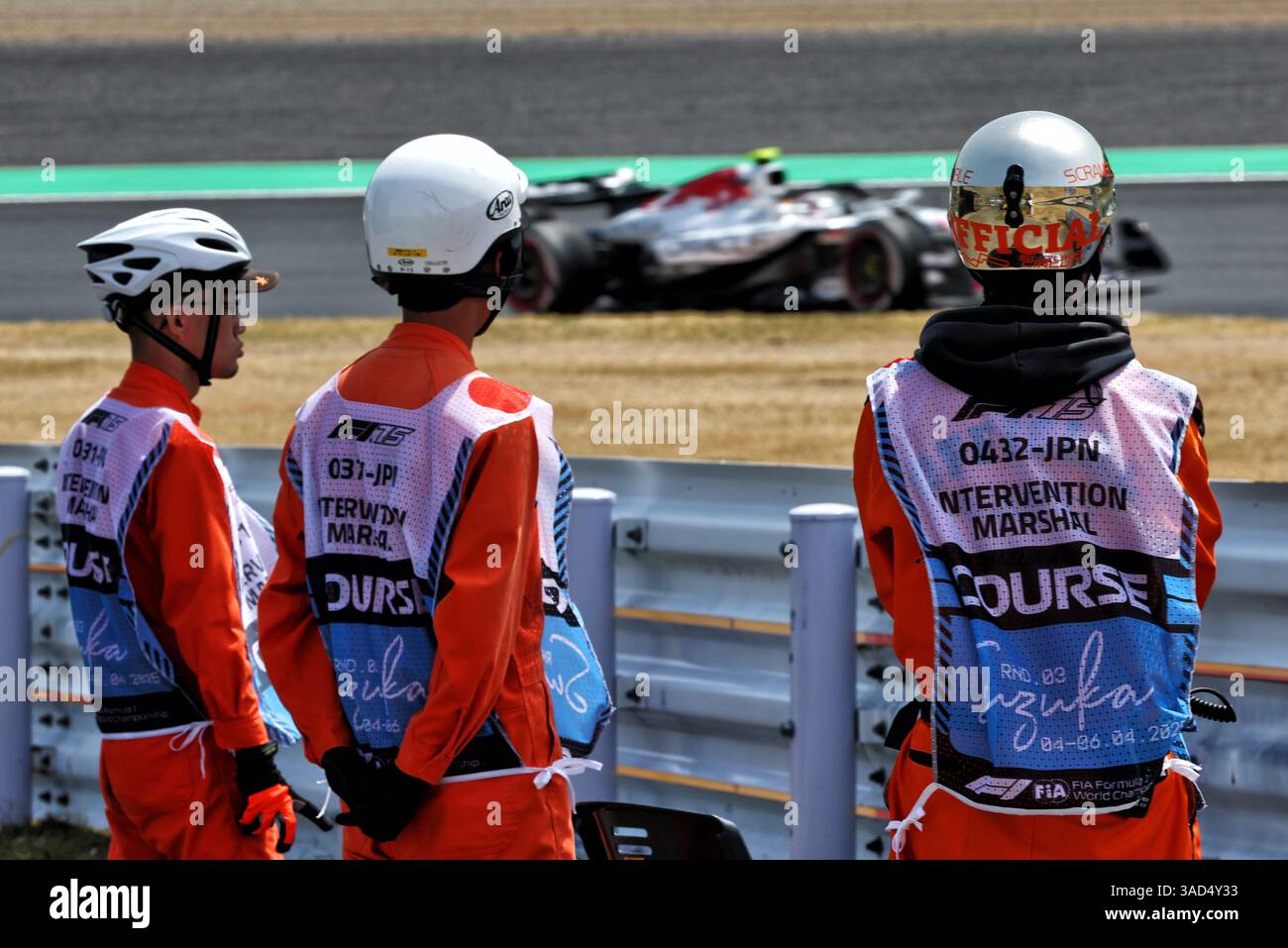 Suzuka, Japan. 05th Apr, 2025. Marshals watch Yuki Tsunoda (JPN) Red Bull Racing RB21. 05.04. ...