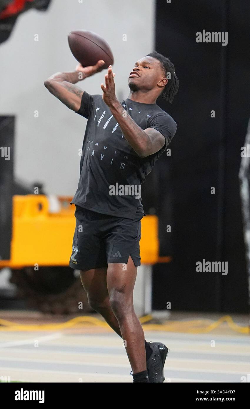 Colorado wide receiver Travis Hunter (12) takes part in passing drills ...
