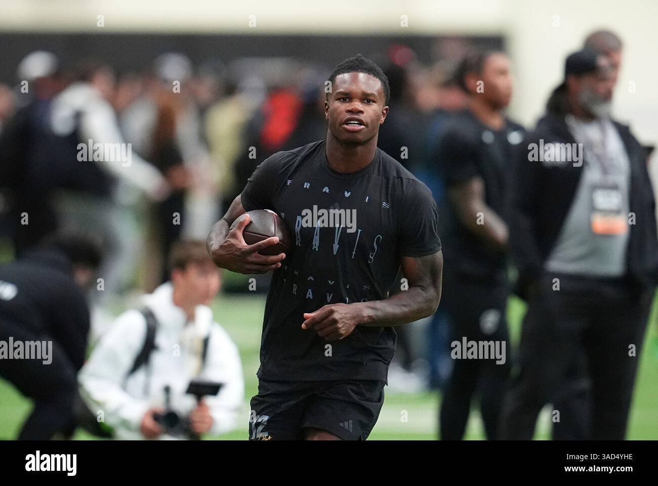 Colorado wide receiver Travis Hunter (12) takes part in passing drills ...