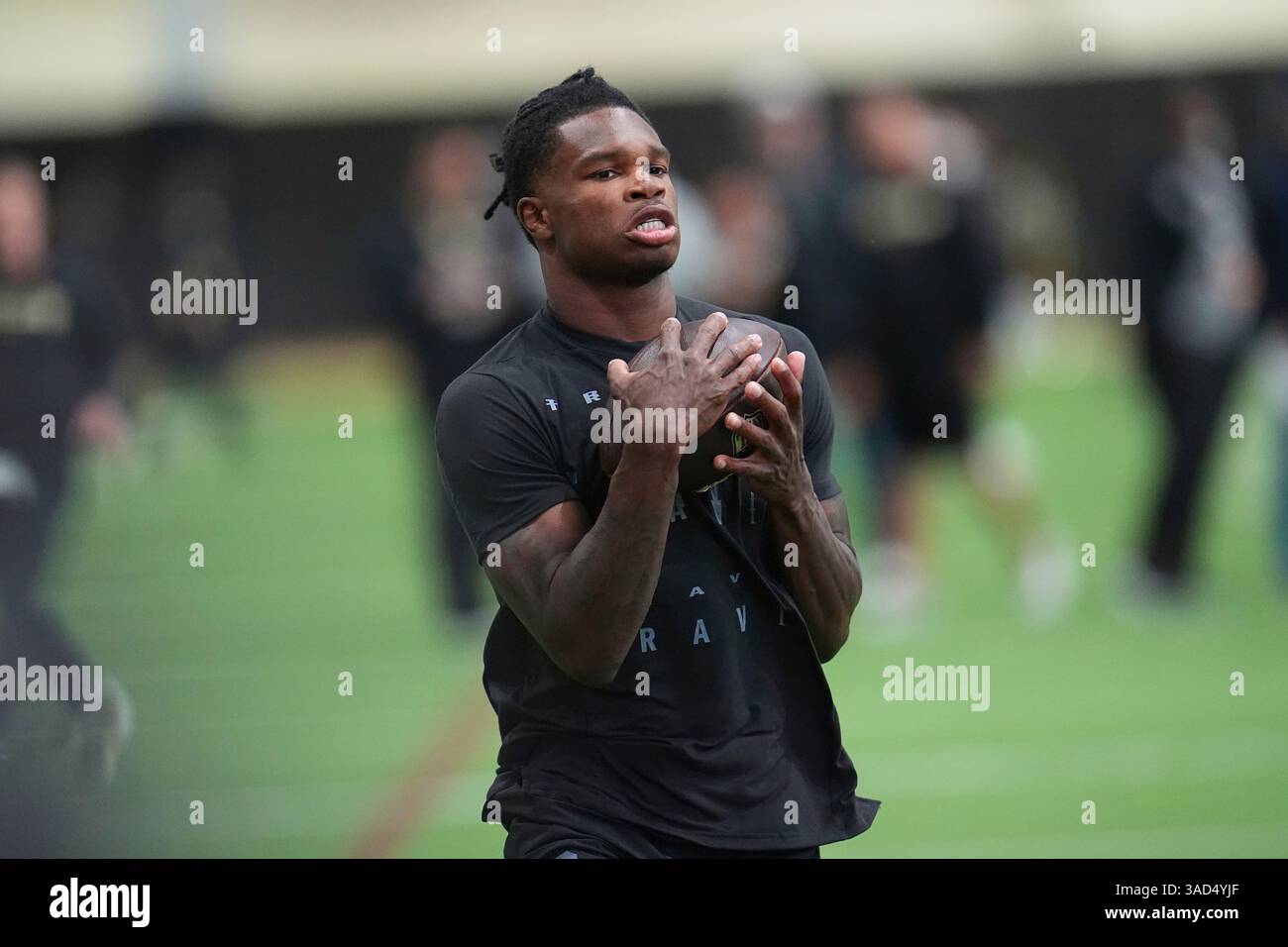 Colorado wide receiver Travis Hunter (12) takes part in passing drills ...