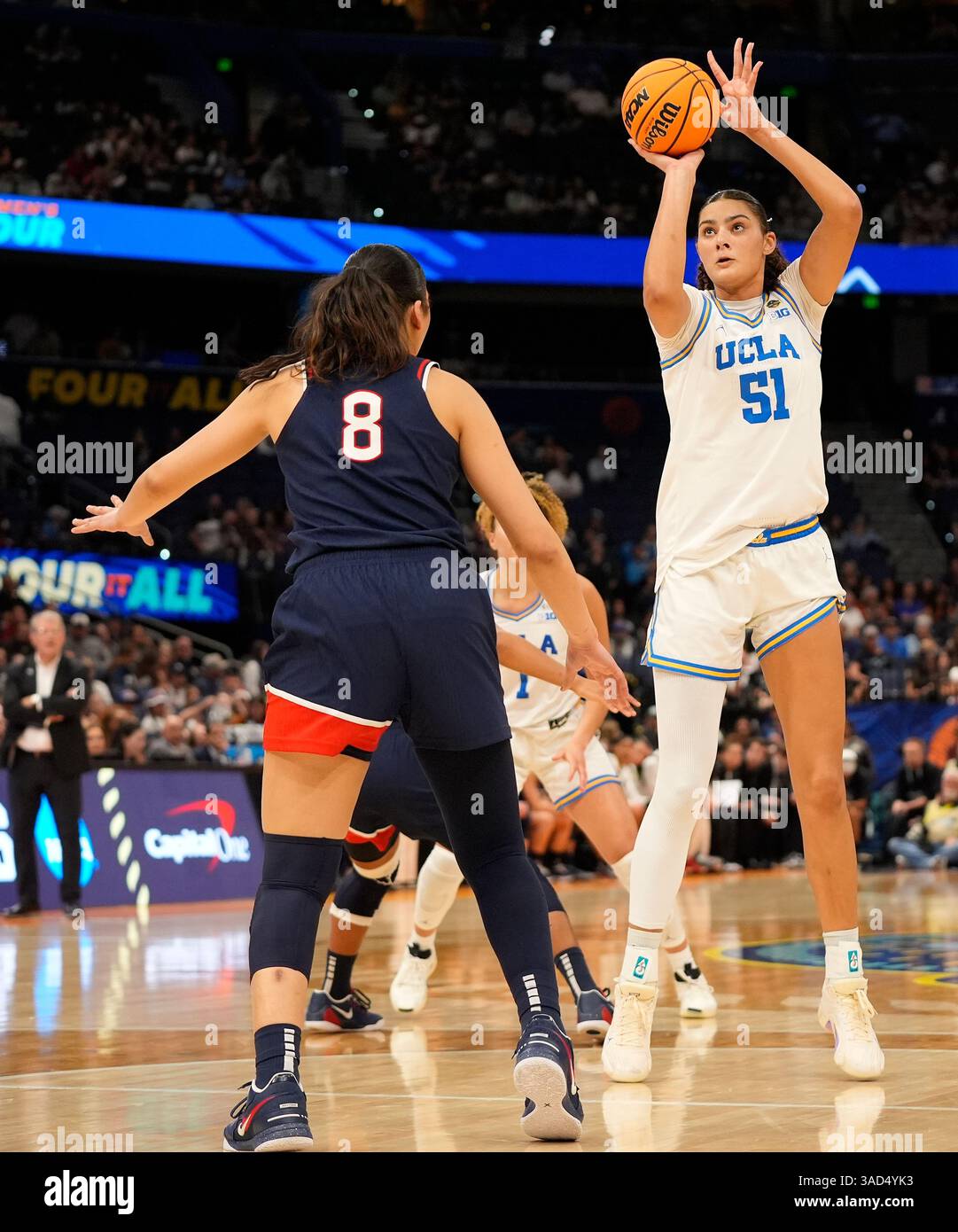 UCLA center Lauren Betts (51) shoots against UConn center Jana El Alfy (8) during the first half ...