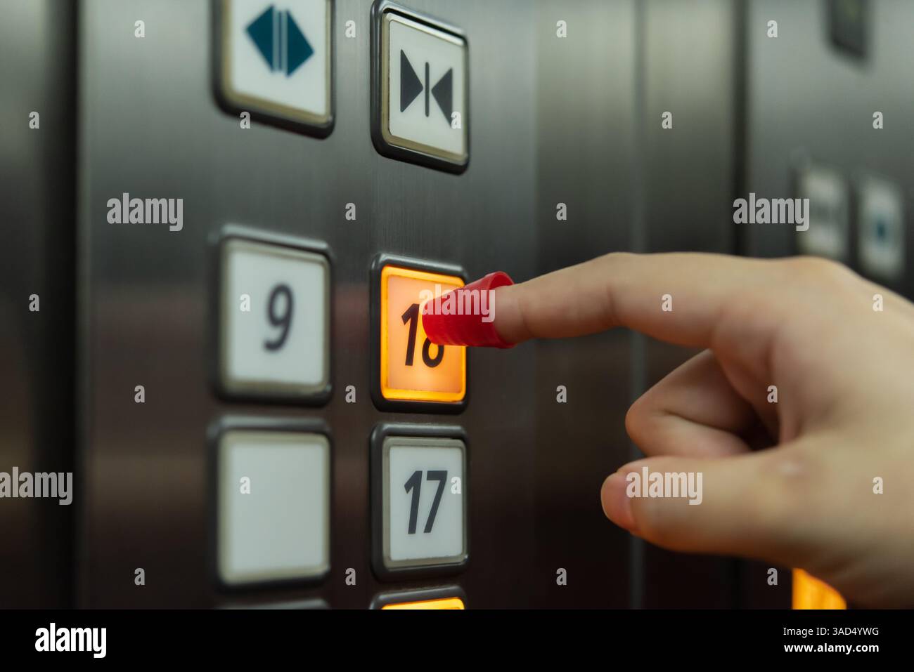 People wear finger shield when pressing the button in the elevator for ...