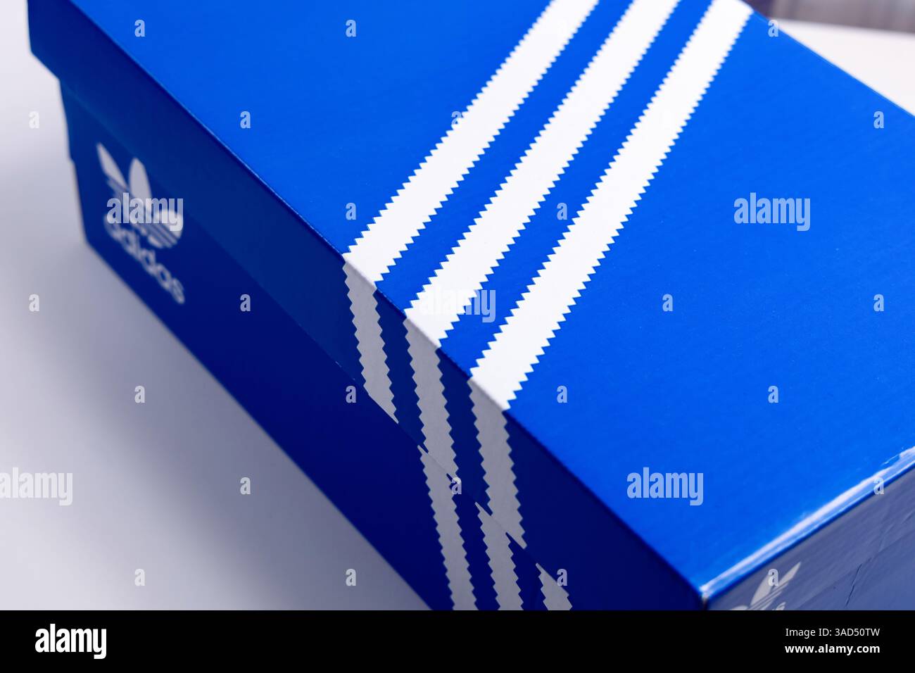 Blue Adidas shoe box with trademark and three white stripes. Copenhagen ...