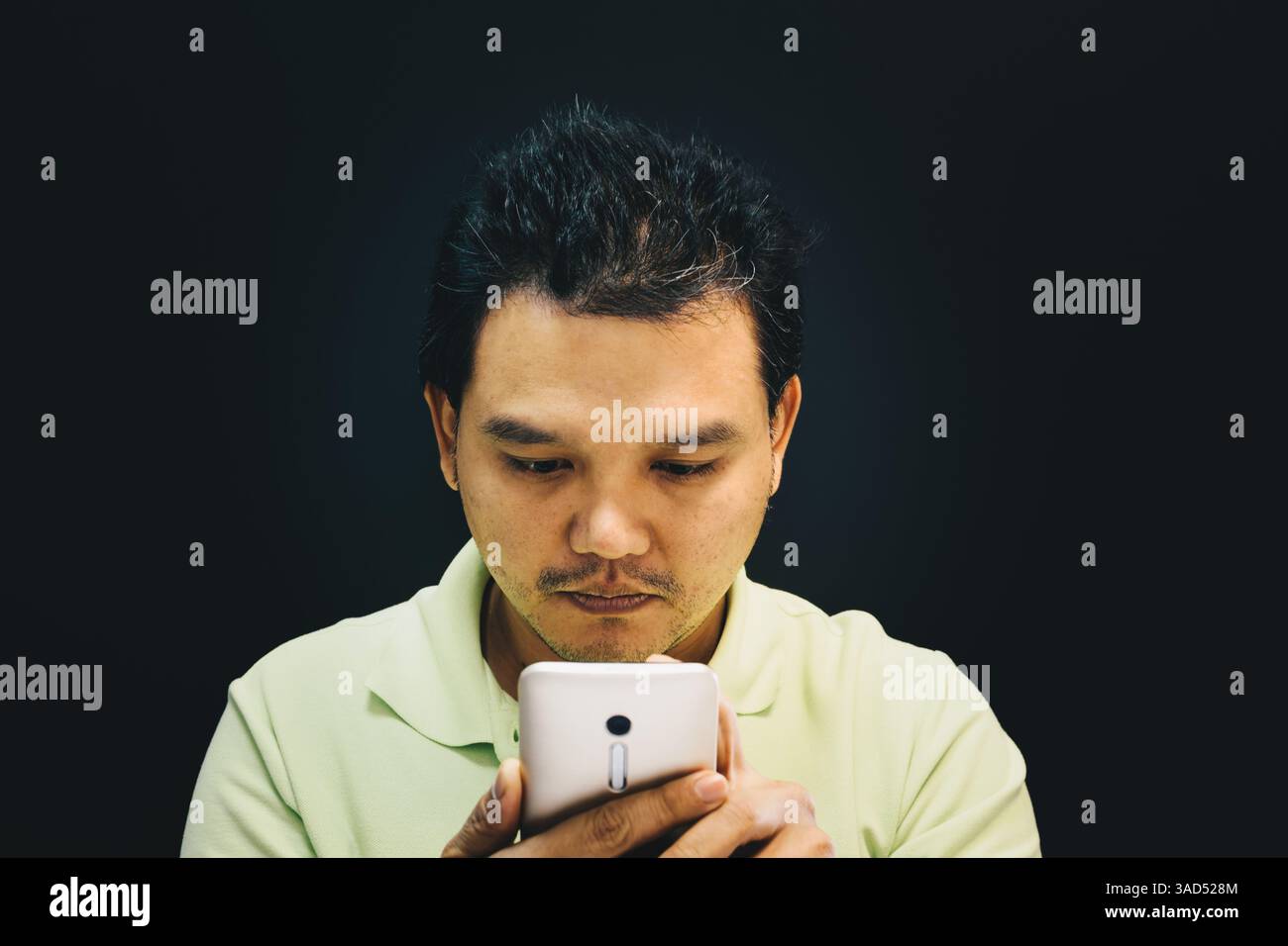 Asian man 40s have a short hair in polo shirt smiling have a thinking ...