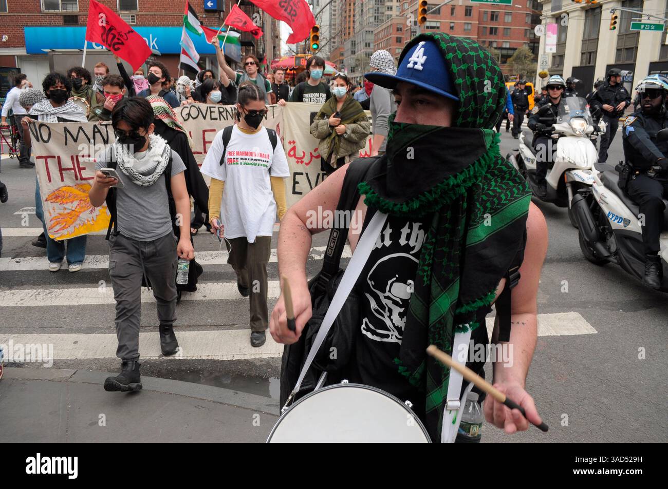 New York, United States. 04th Apr, 2025. A protester plays a drum ...