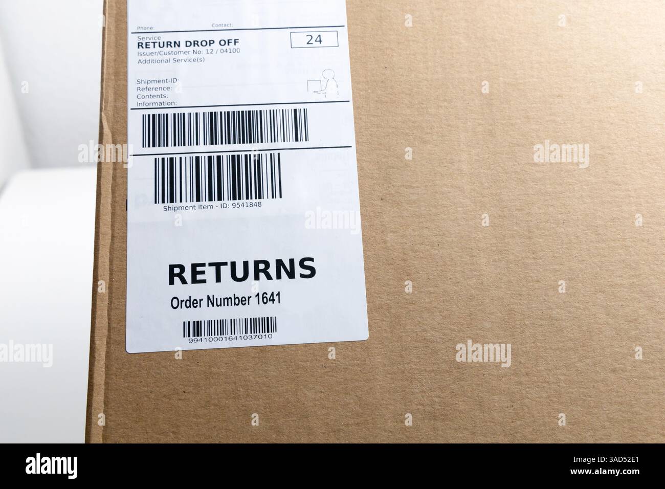 Packaging with return label and barcode for returning Stock Photo - Alamy