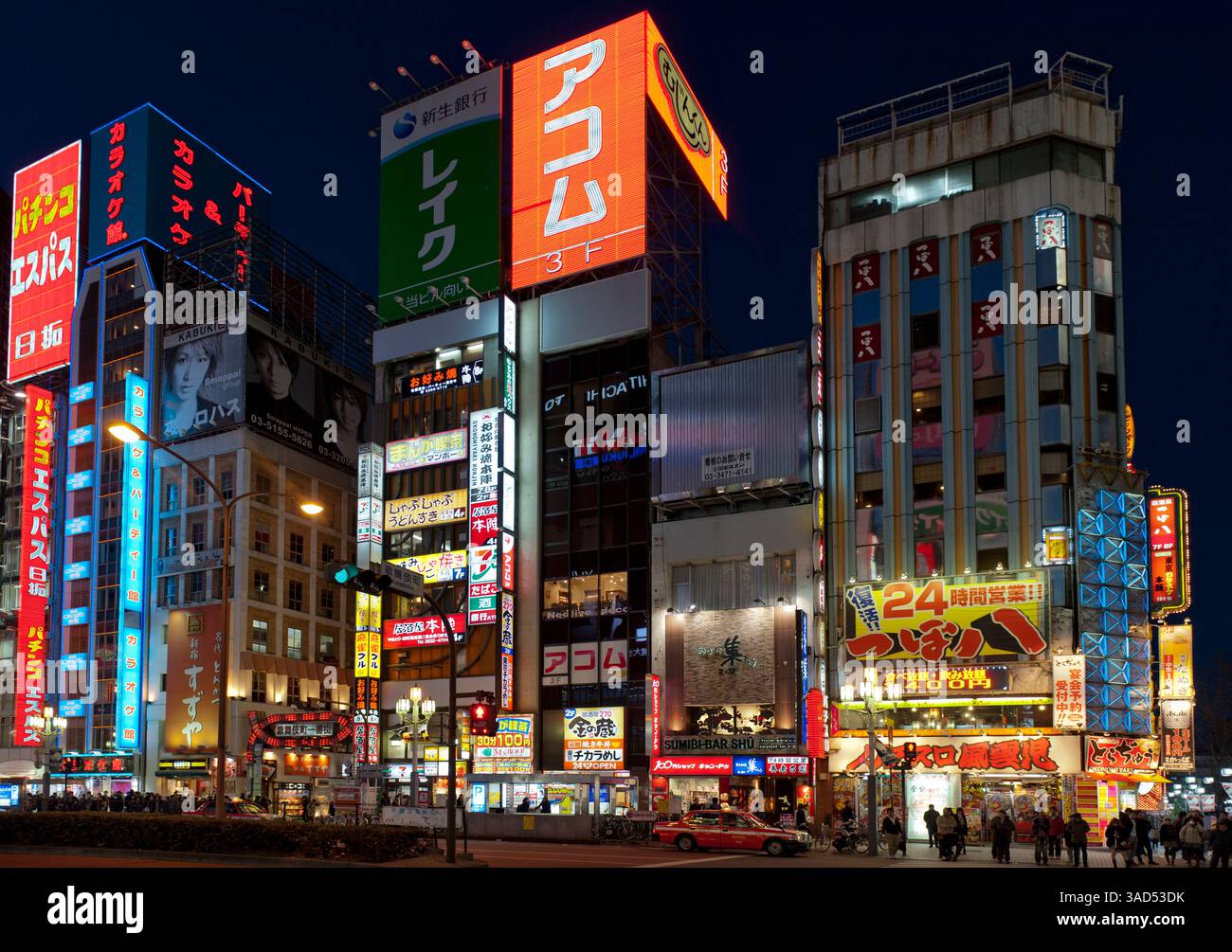 Kabukicho building facades glow in the night with neon signs, the ...