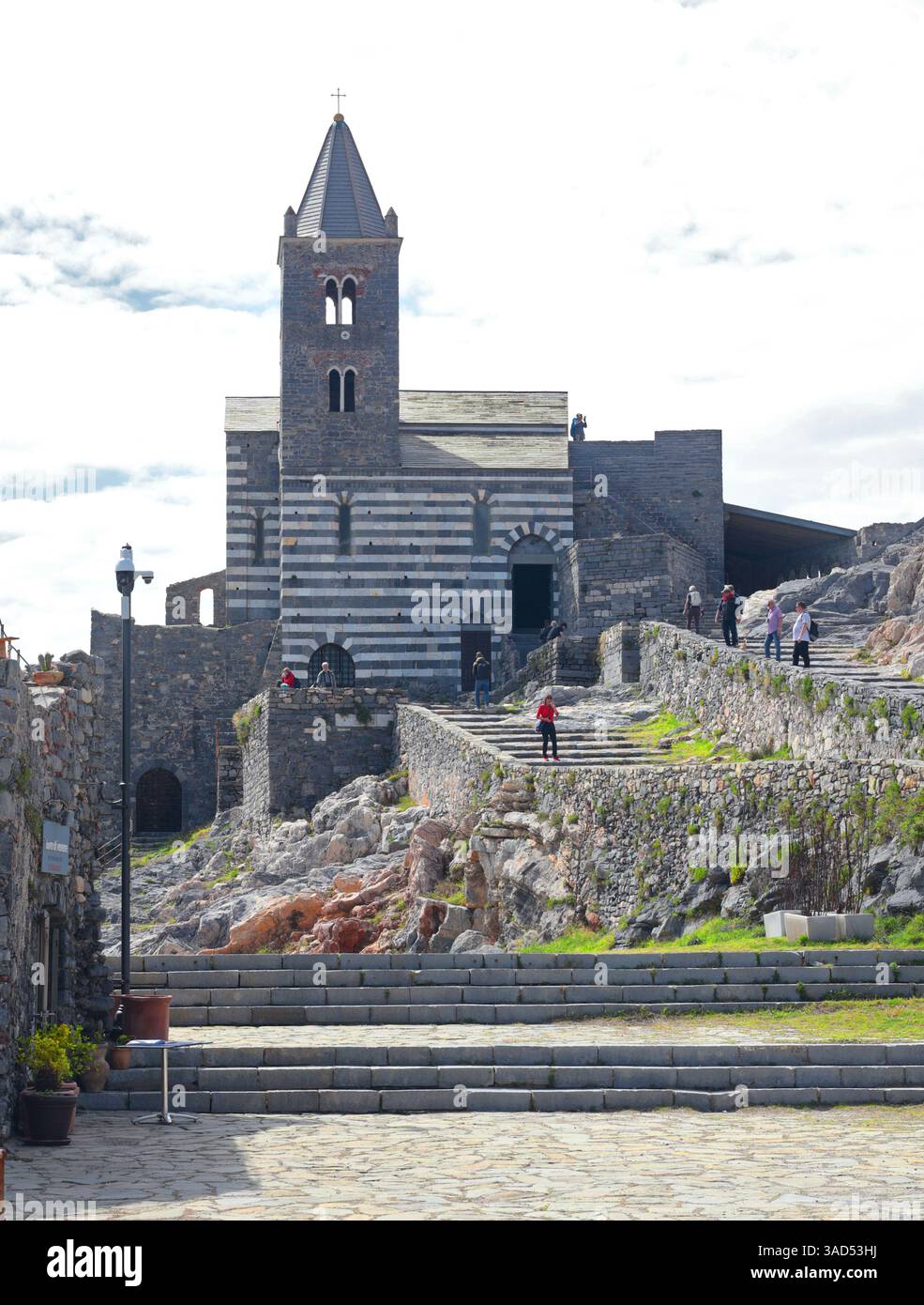 Porto Venere, Italy - 02 April 2025. Stone steps and medieval church ...