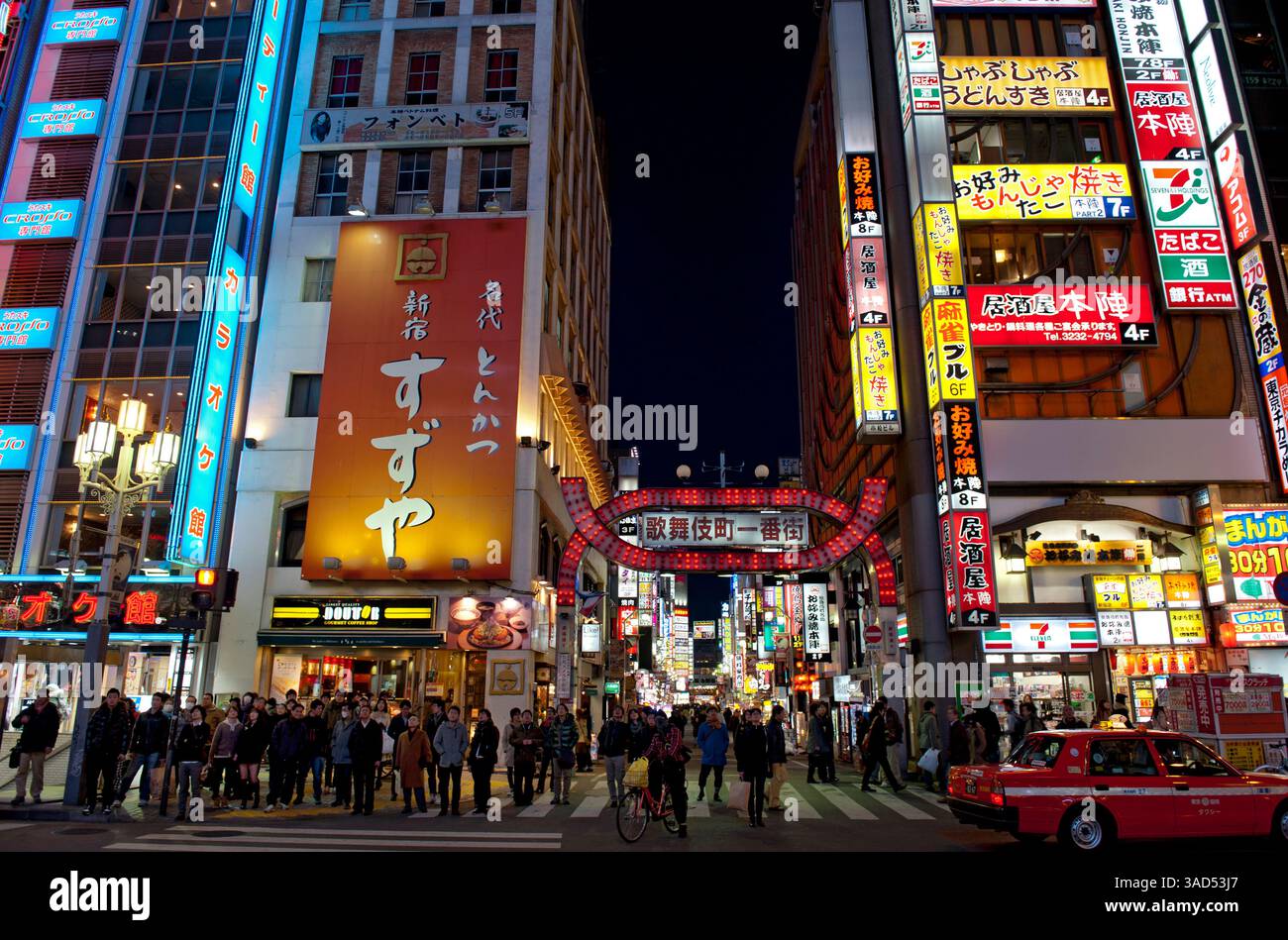 Kabukicho building facades glow in the night with neon signs, the ...