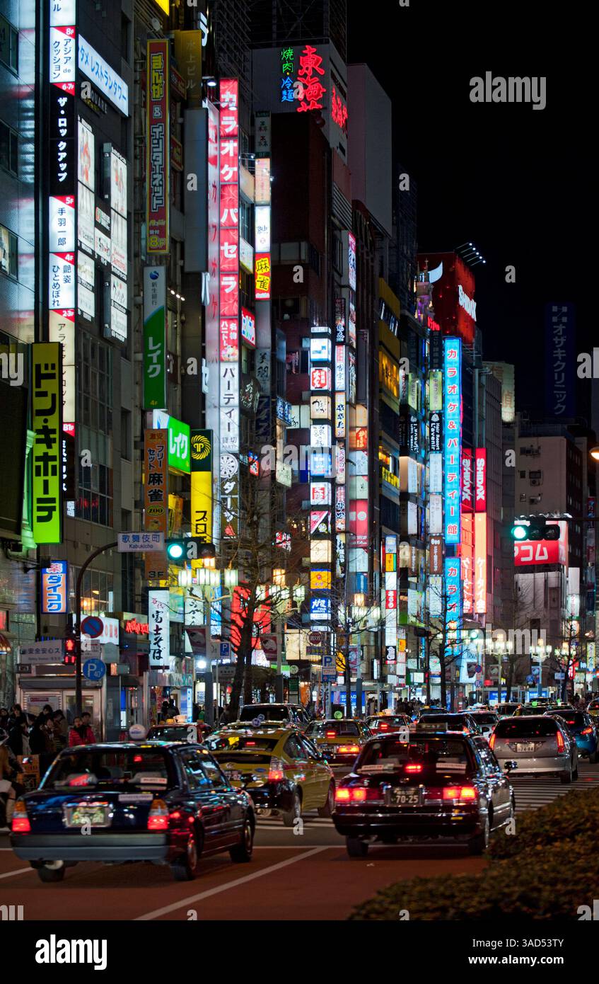 Kabukicho building facades glow in the night with neon signs, the ...
