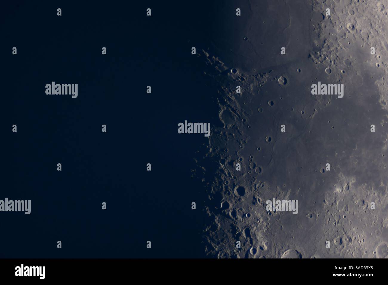 Close-up view of the moon's craters along lunar terminator. Planetary ...