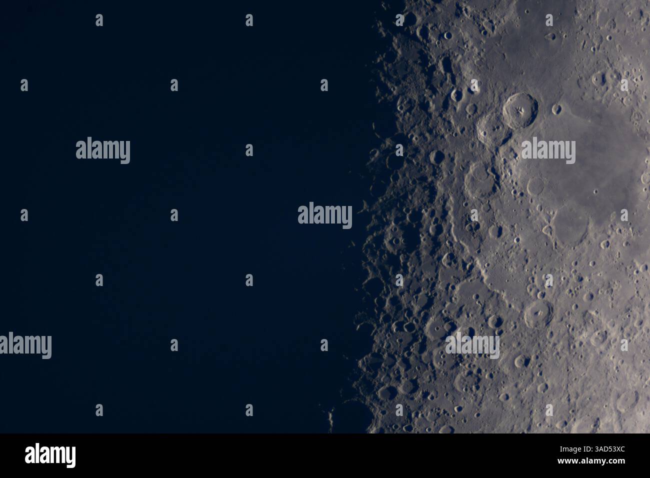 Detailed lunar craters visible near moon's shadow terminator line ...
