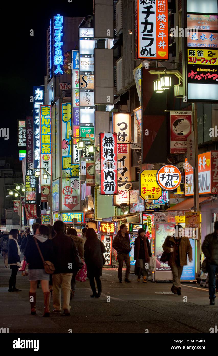 Kabukicho building facades glow in the night with neon signs, the ...