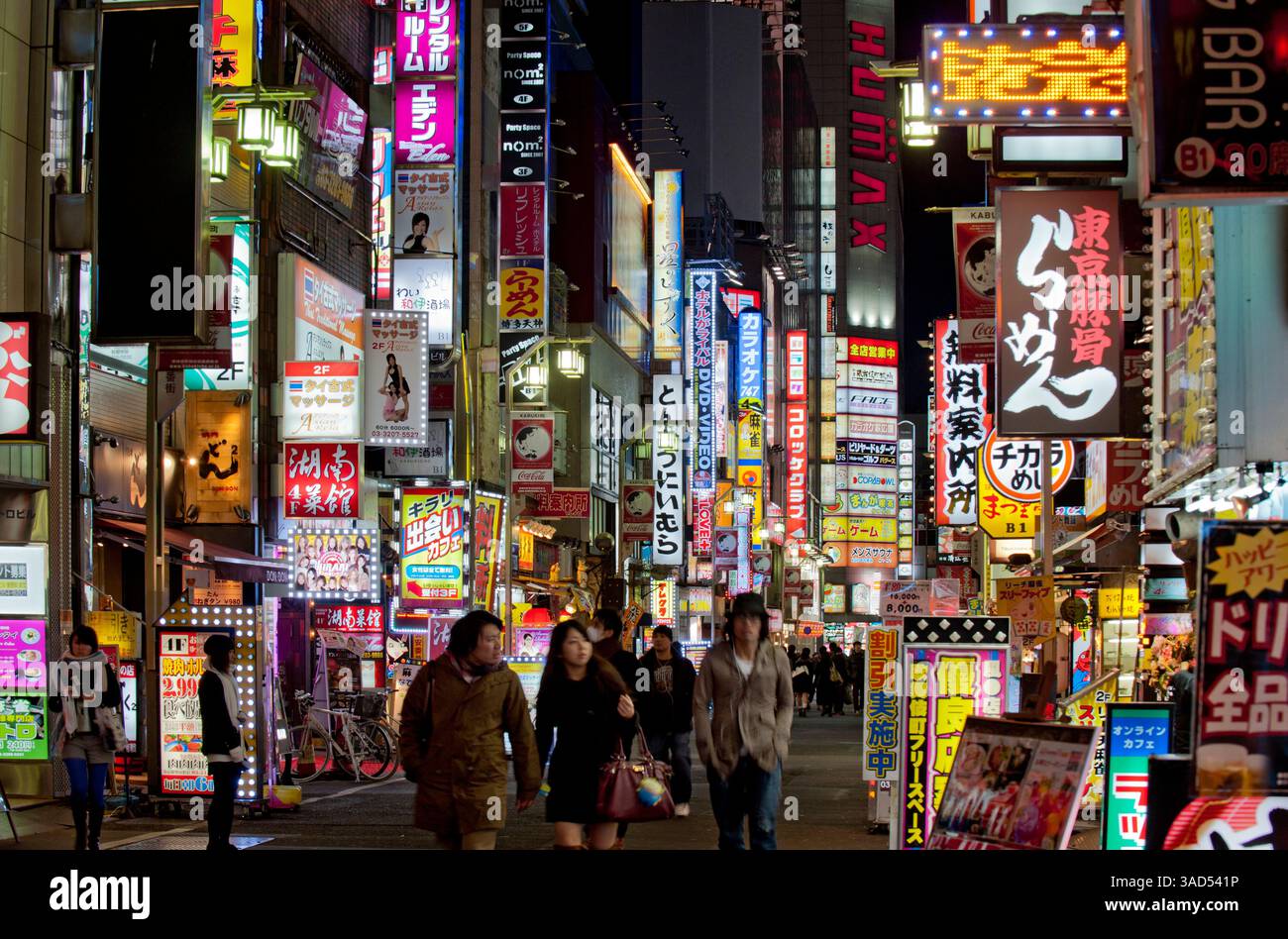 Kabukicho building facades glow in the night with neon signs, the ...