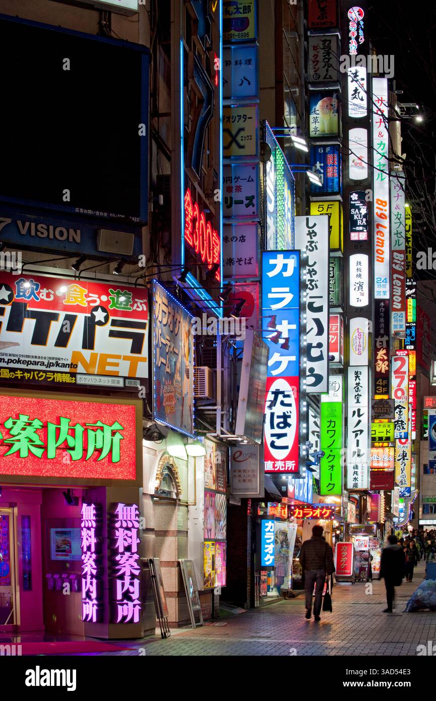 Kabukicho building facades glow in the night with neon signs, the ...