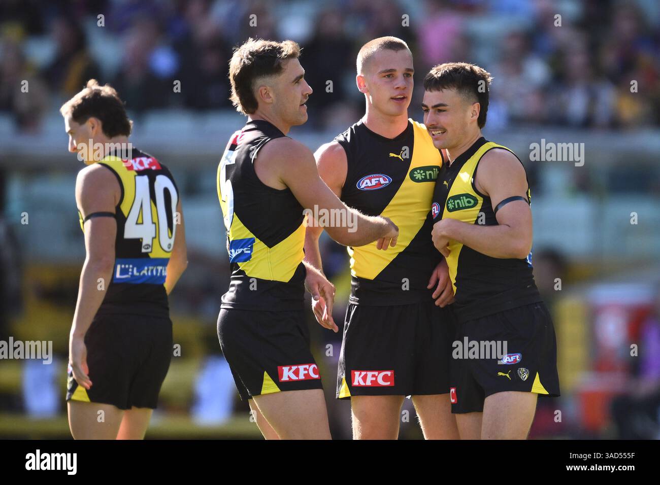 Steely Green of Richmond (right) celebrates scoring a goal with Sam ...