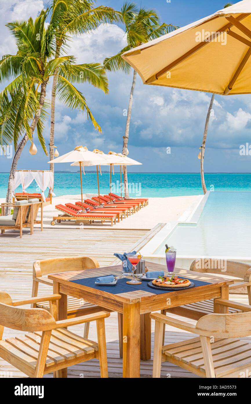 Sunny beach vacation with colorful breakfast lunch table by pool luxury ...