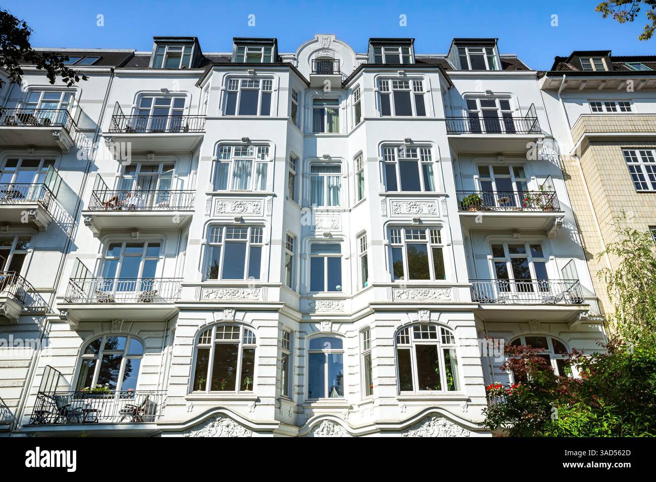 The residential white building with amazing decorations on the walls ...