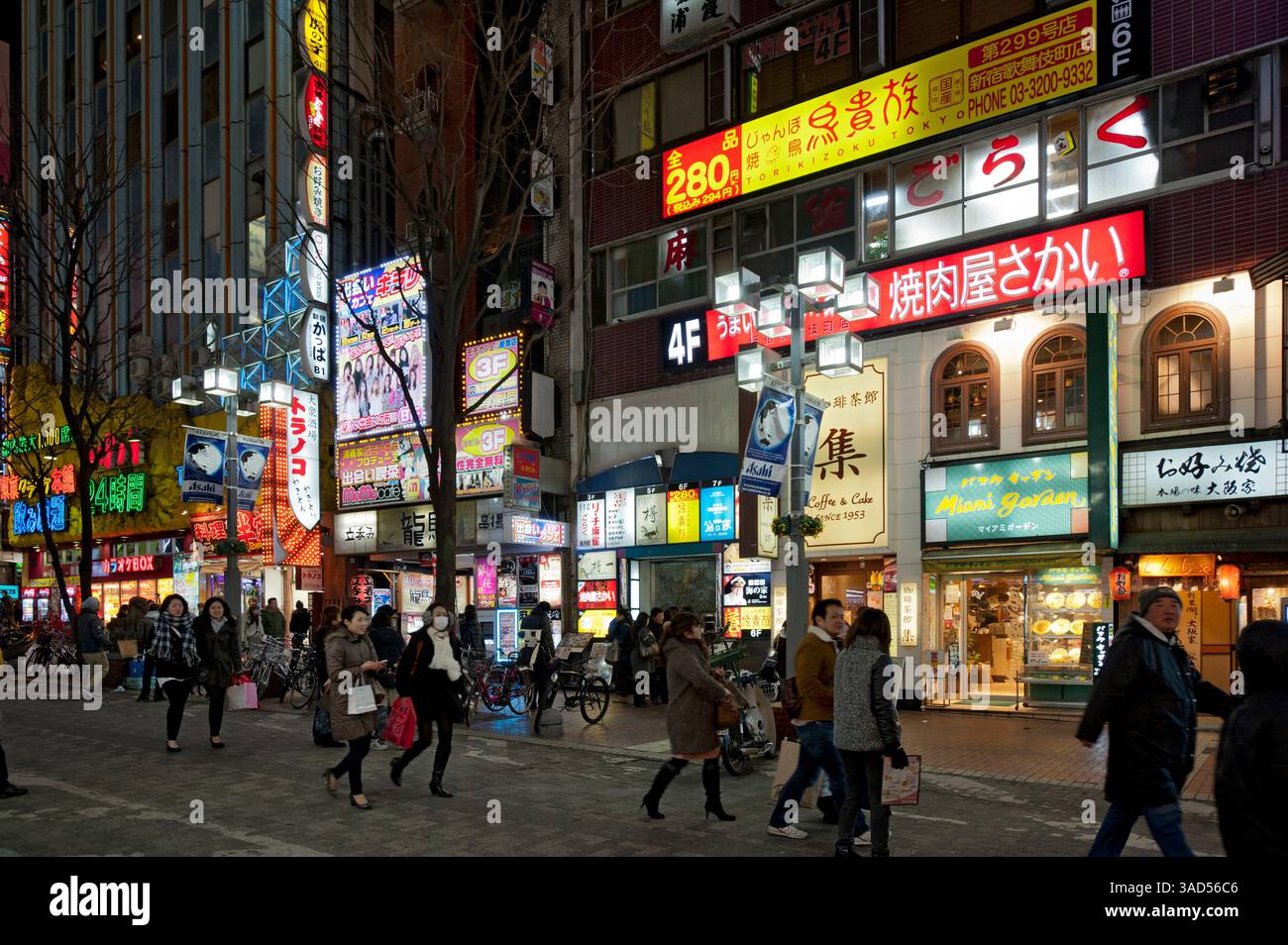 Kabukicho building facades glow in the night with neon signs, the ...