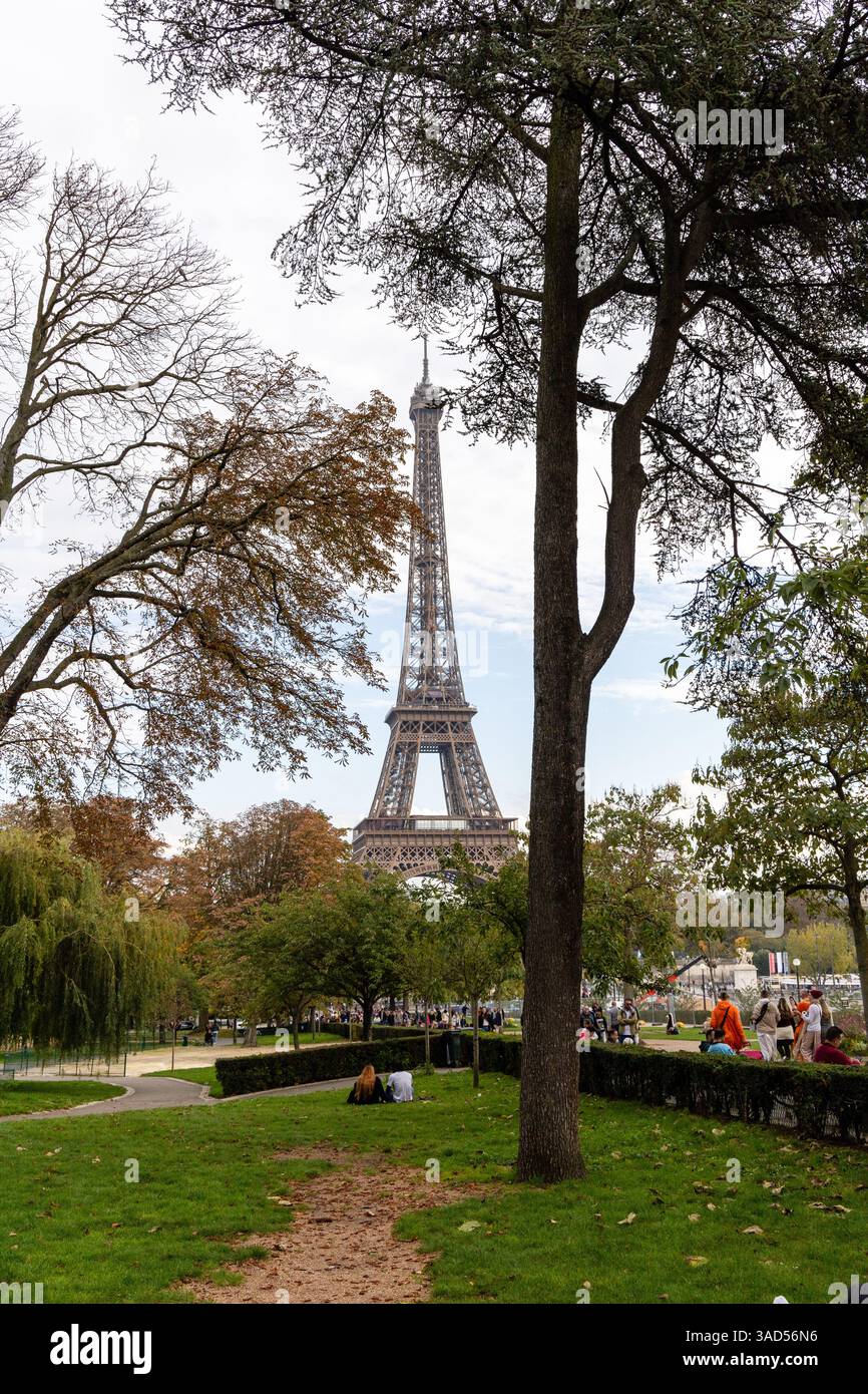 The Eiffel Tower is beautifully surrounded by lush greenery in the ...