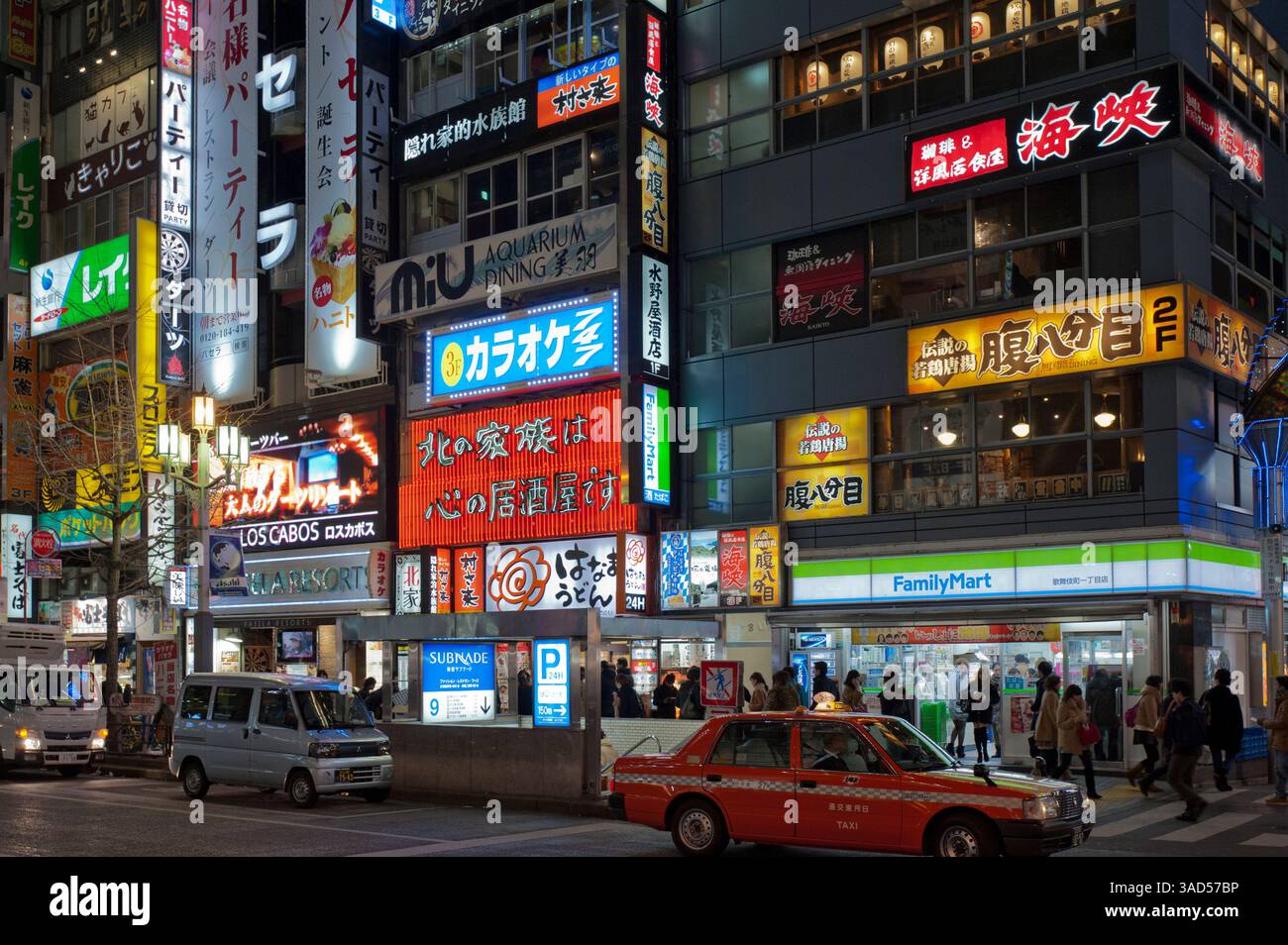 Kabukicho building facades glow in the night with neon signs, the ...