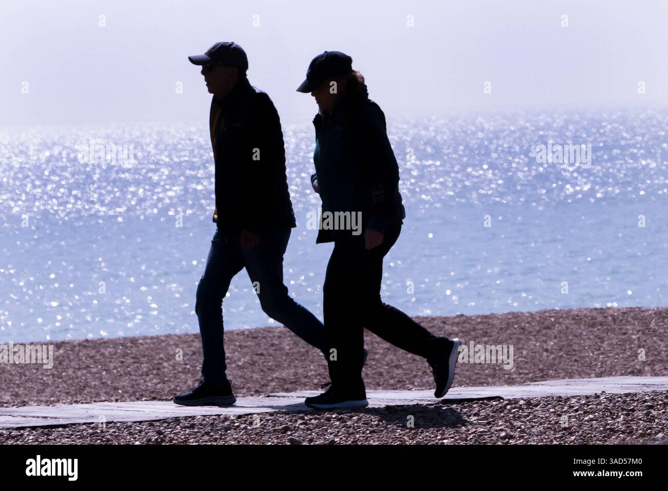 Walkers on the Folkestone beach boardwalk Folkestone Kent UK Stock ...