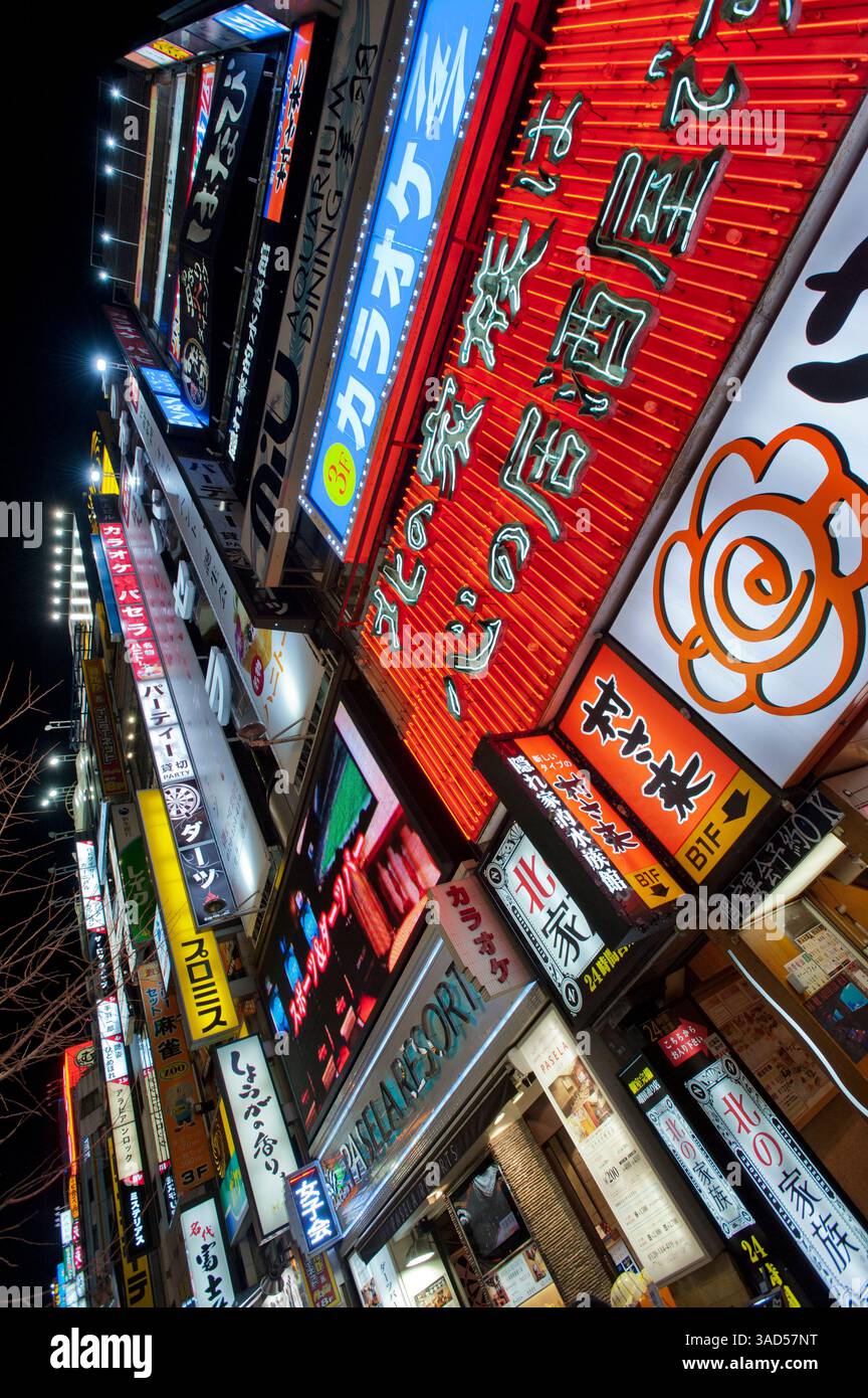 Kabukicho building facades glow in the night with neon signs, the ...