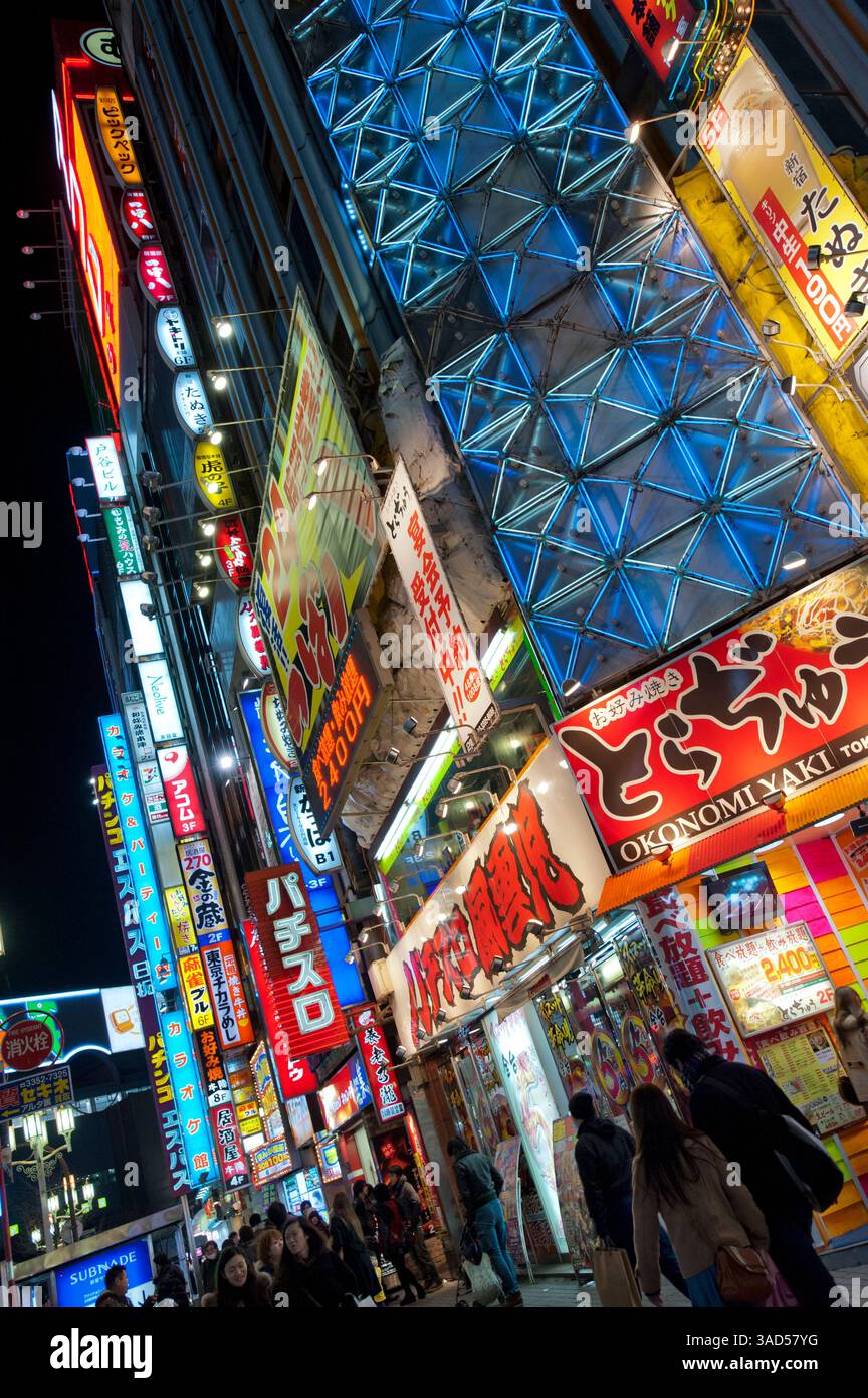 Kabukicho building facades glow in the night with neon signs, the ...
