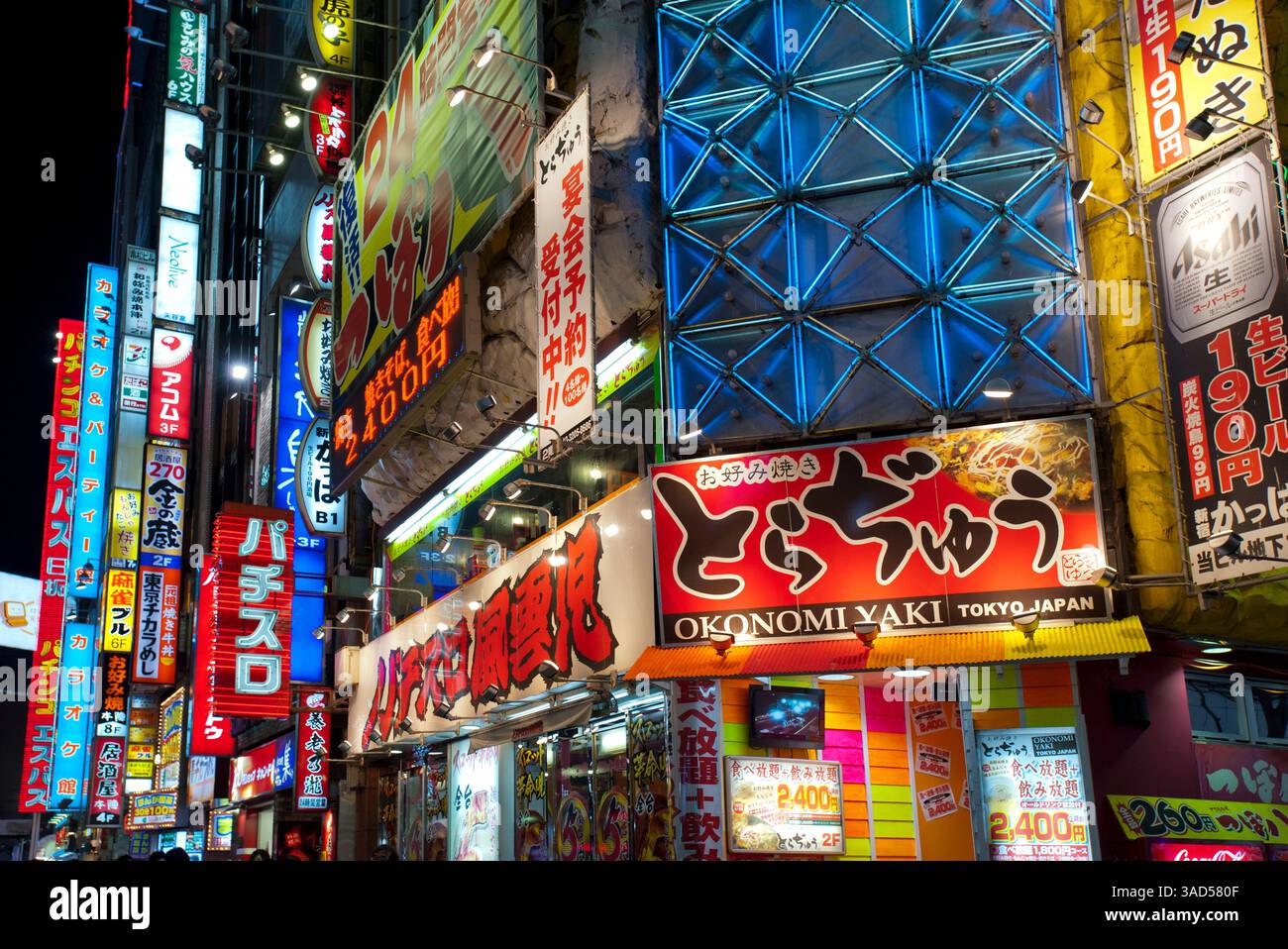 Kabukicho building facades glow in the night with neon signs, the ...