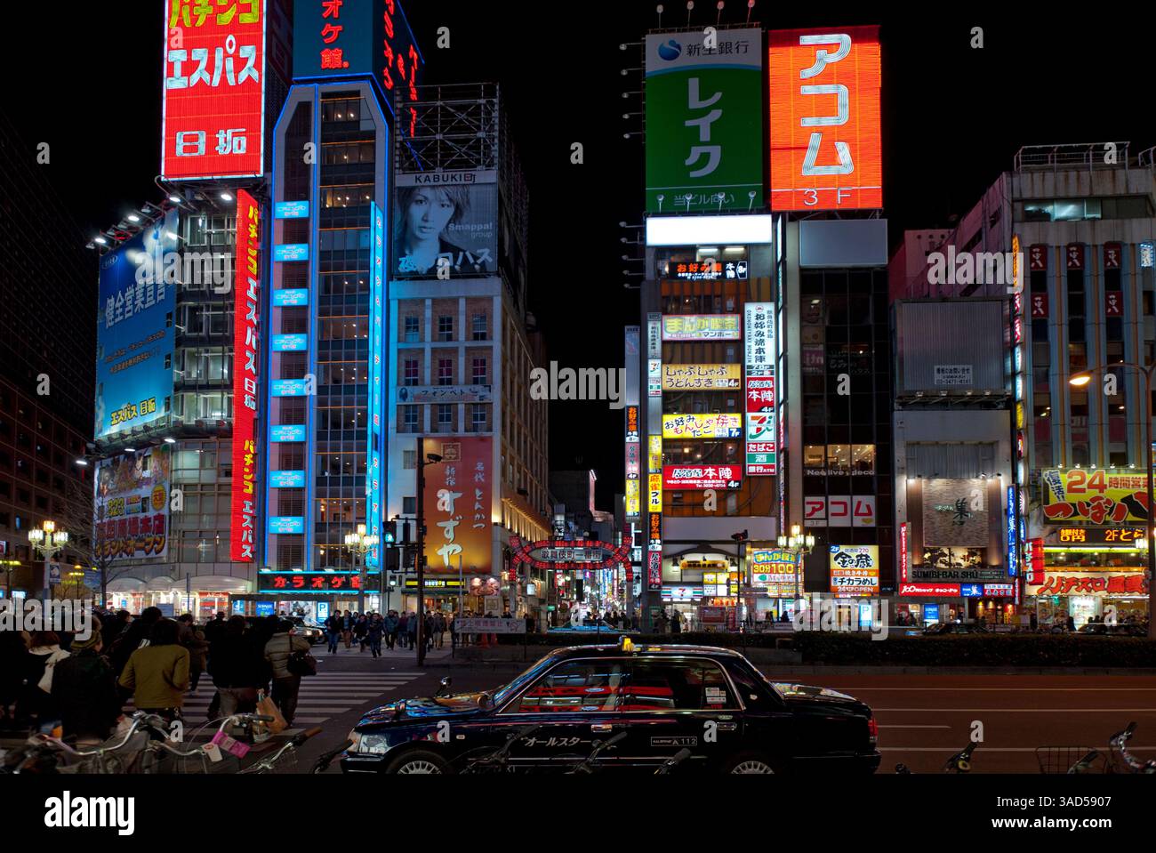 Kabukicho building facades glow in the night with neon signs, the ...
