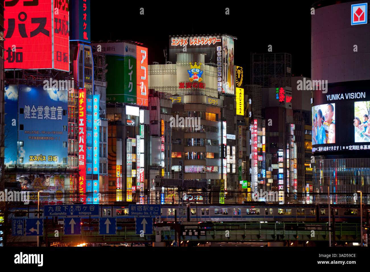 Neon signs light up the night in the Kabukicho entertainment district ...