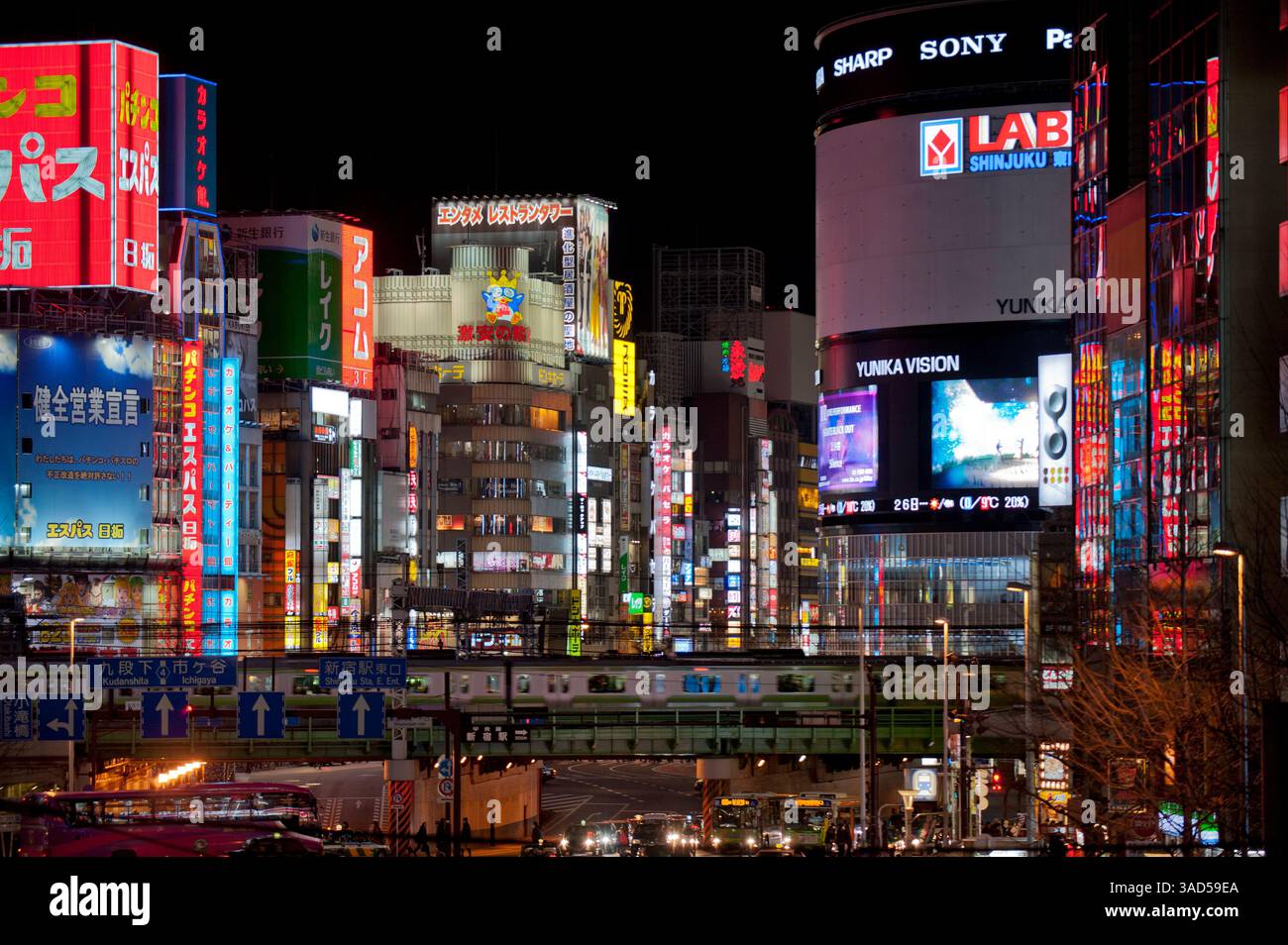 Neon signs light up the night in the Kabukicho entertainment district ...