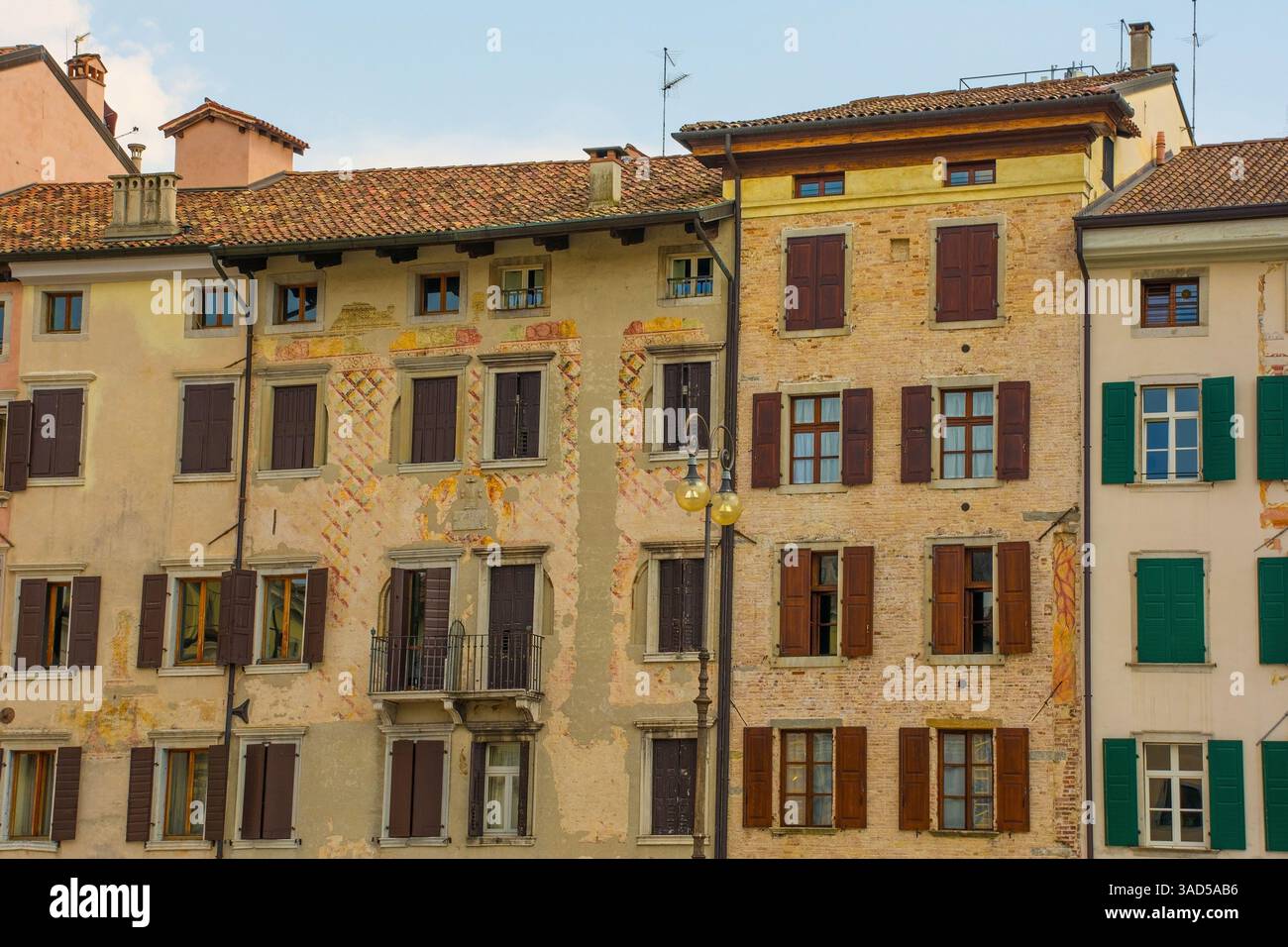 A row of buildings lining Piazza Giacomo Matteotti square in Udine ...