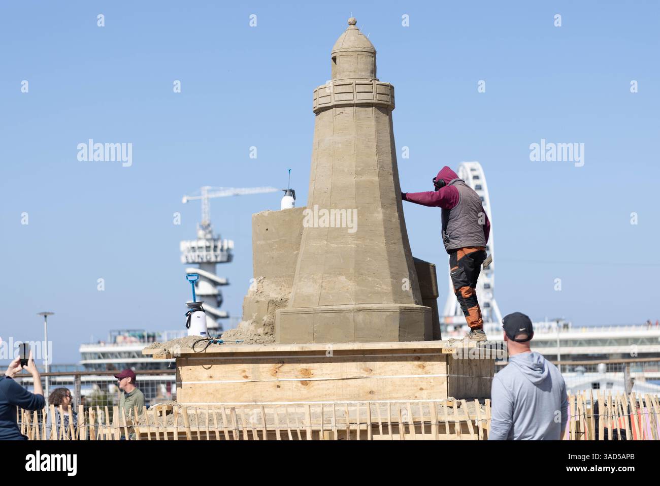 The Hague, Netherlands. 4th Apr, 2025. An artist works on a sand ...