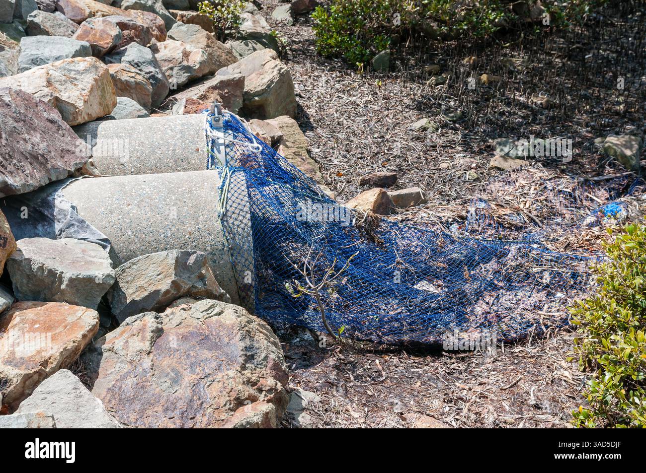 stormwater net, Blue litter trap net attached to drainage pipe ...
